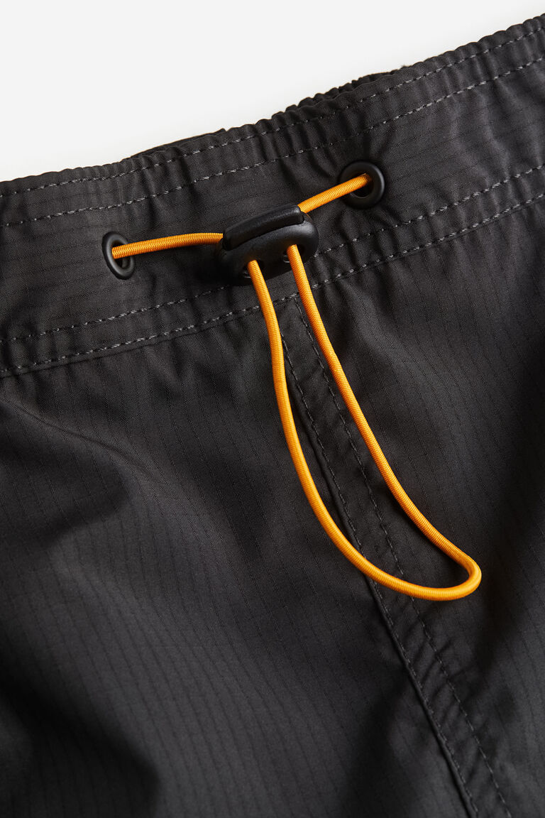 Leg-pocket swim shorts