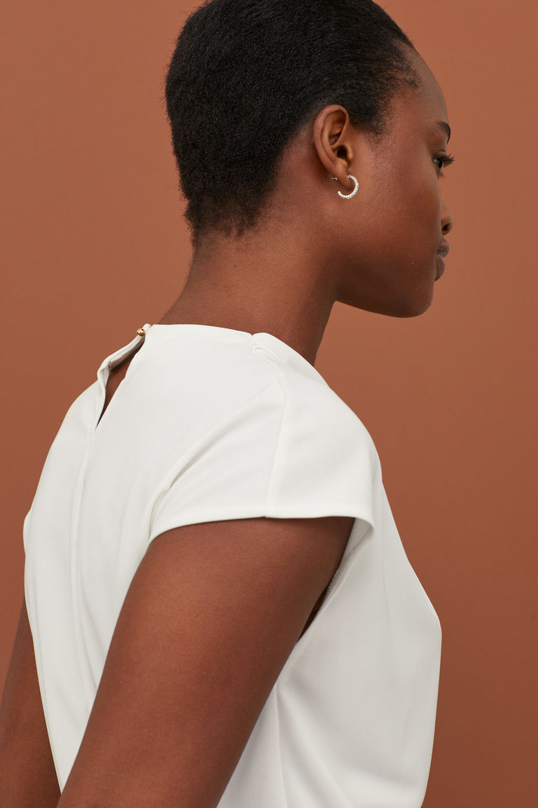 Top with a draped collar