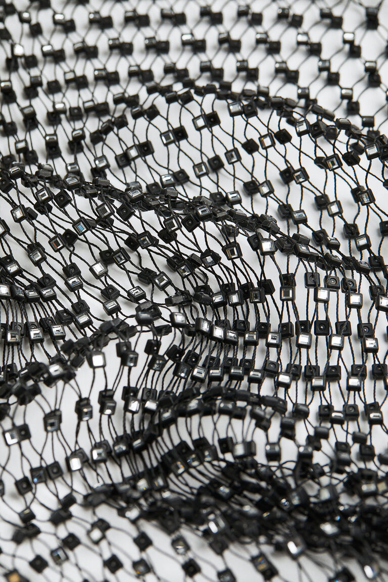 Rhinestone-embellished fishnet skirt