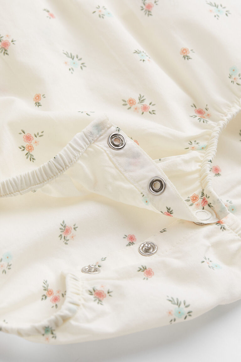 Flounce-trimmed romper suit