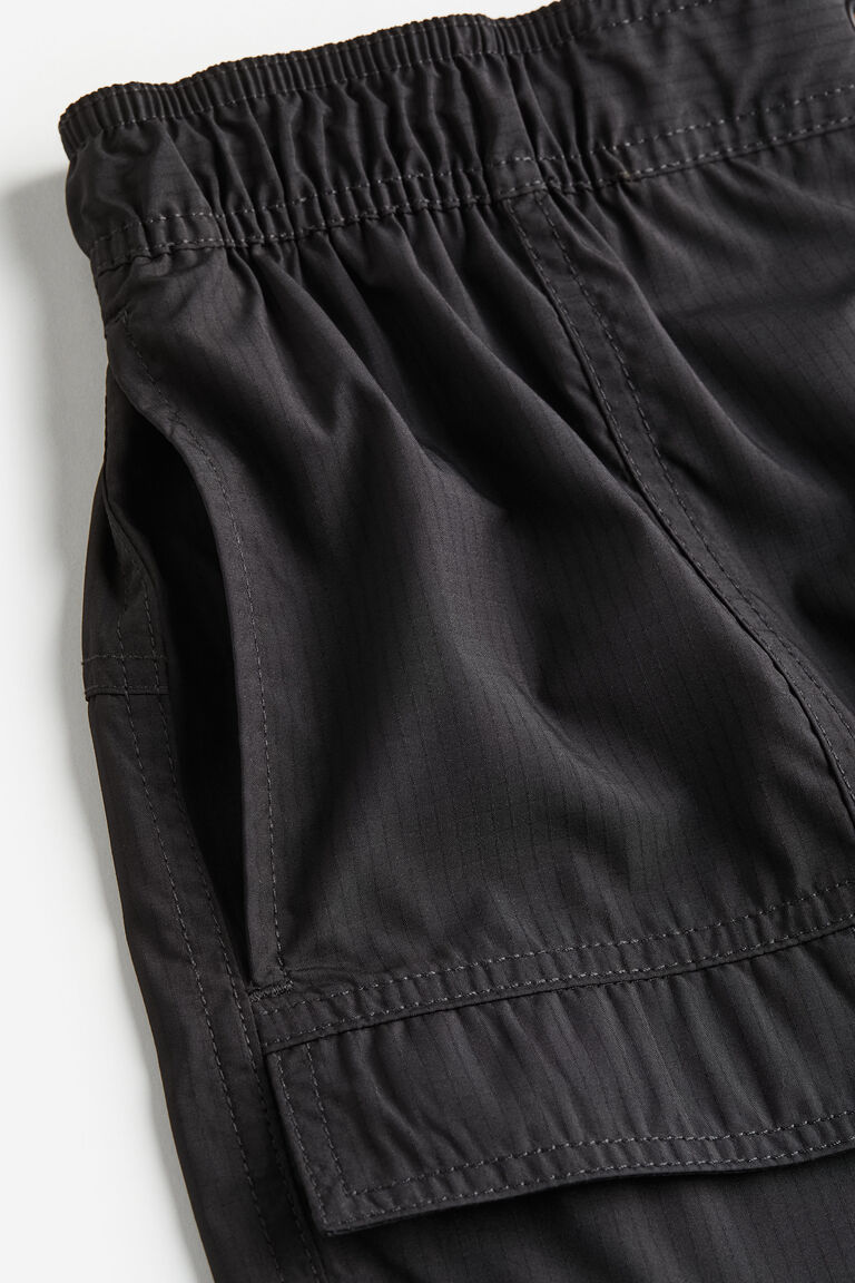 Leg-pocket swim shorts
