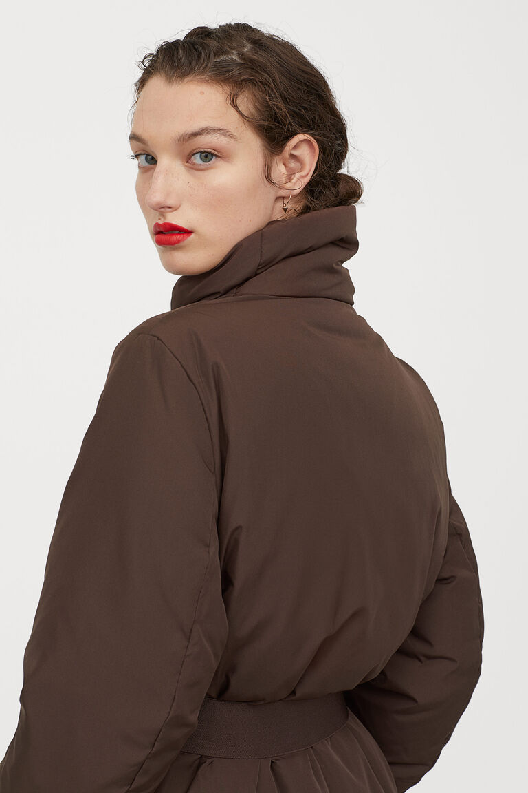 Down coat with a belt